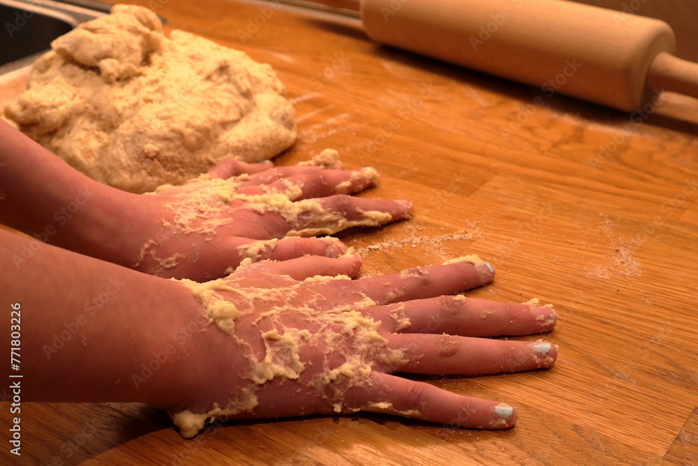 Baking in progress. Messy hands. Dough. Home made bakery. Rolling pin ...