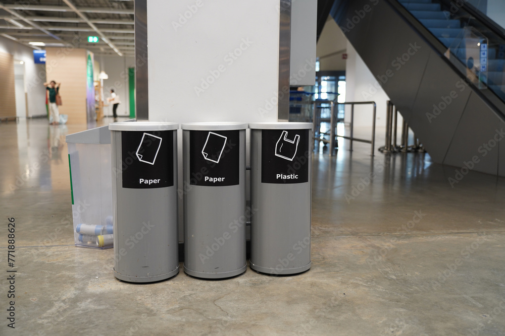 Trash cans with signs to classify waste types in building Stock Photo ...