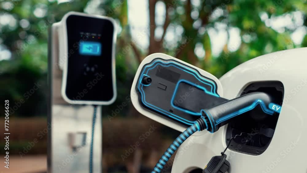 Electric car recharging battery by futuristic smart EV charger from eco ...