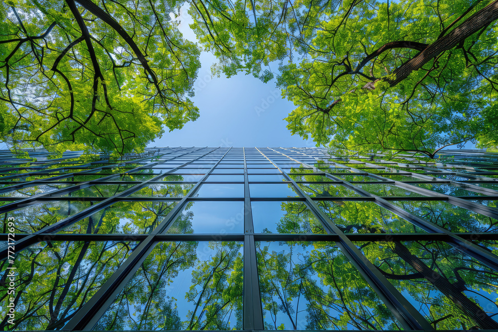 Green building, glass curtain wall architecture with green trees ...
