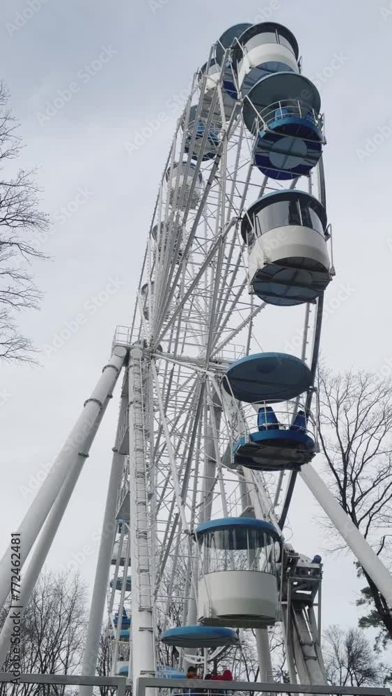 Ferris wheel, or devil's wheel, an amusement park ride, underside or ...