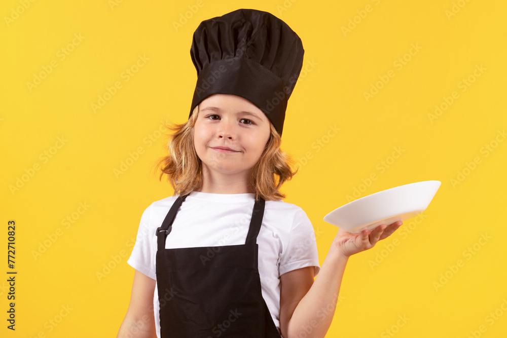 Cute kid boy cook with cooking plate. Child chef cook, studio portrait ...