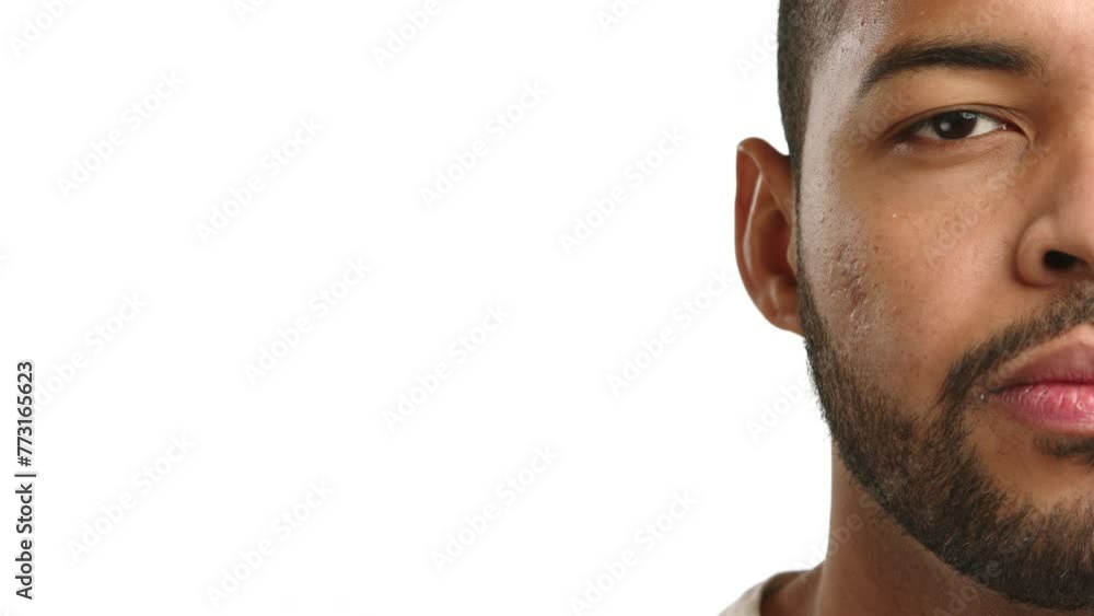 A close-up side portrait of a serious young man, capturing the subtle ...
