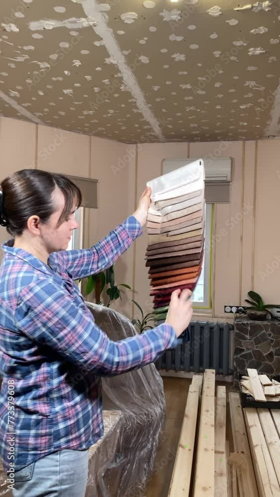 A beautiful woman engages in home improvement, planning preparing for ...