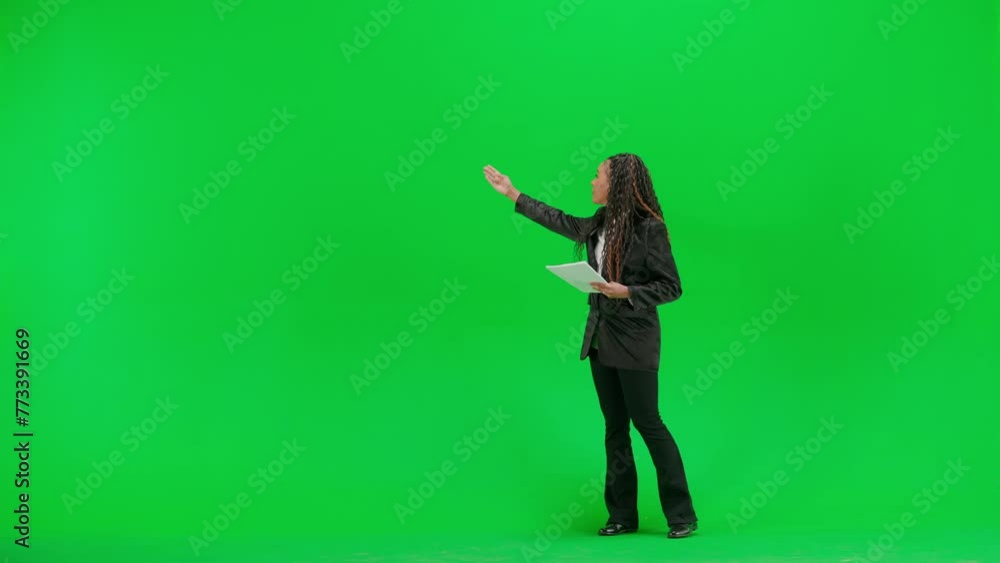 Young female reporter isolated on chroma key green screen background ...