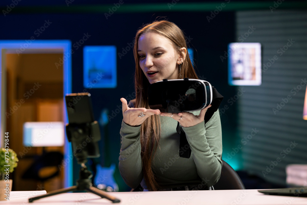 Content creator films technology review of newly released VR glasses ...