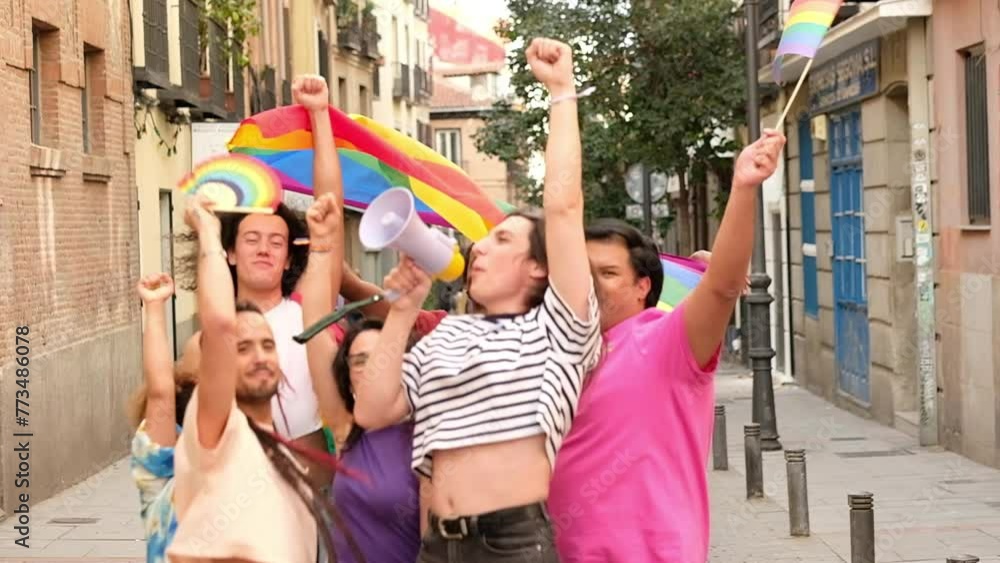 Diverse group of LGBT people having fun with megaphone celebrating gay ...