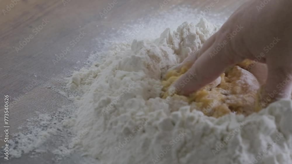 Vidéo Stock female hands kneading dough, adding white and yolk of ...