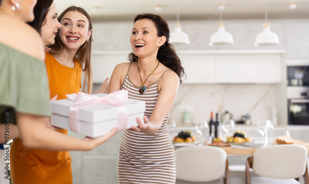 In homely atmosphere, girl meets female three guests, accepts ...