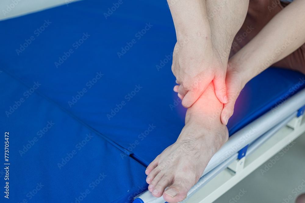 A young man with muscle pain has leg pain due to a pulled calf muscle ...