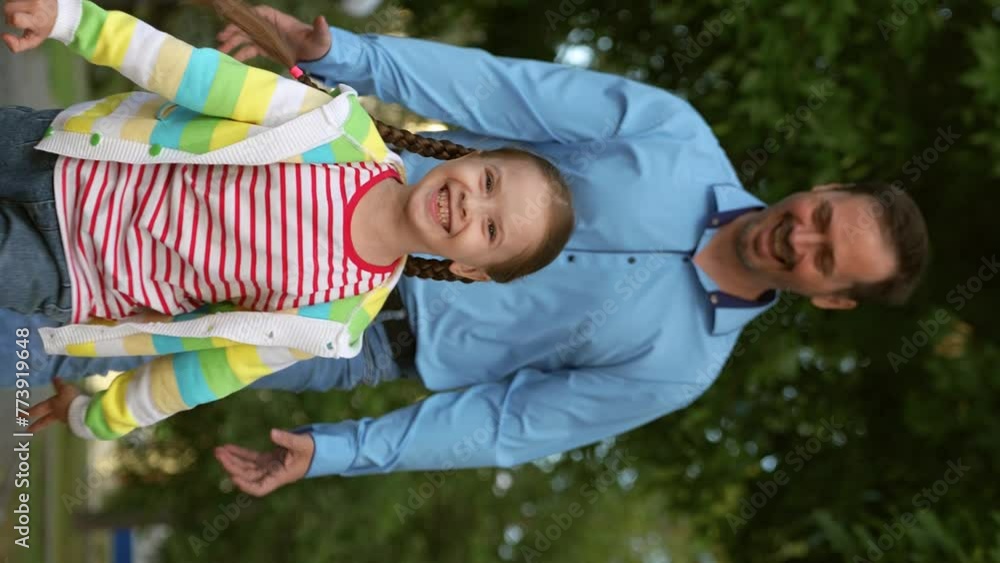 happy father runs through park behind little daughter, happy family ...