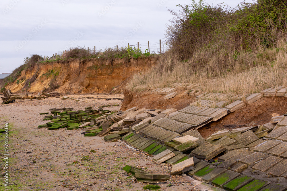 Coastal erosion at Wrabness beach, Essex along the river Stour. Image ...
