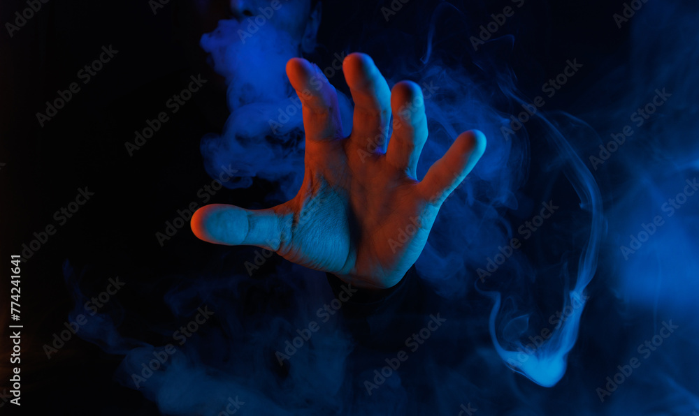 Mystical smoke in scary hands. Mysterious composition. Fortune teller ...