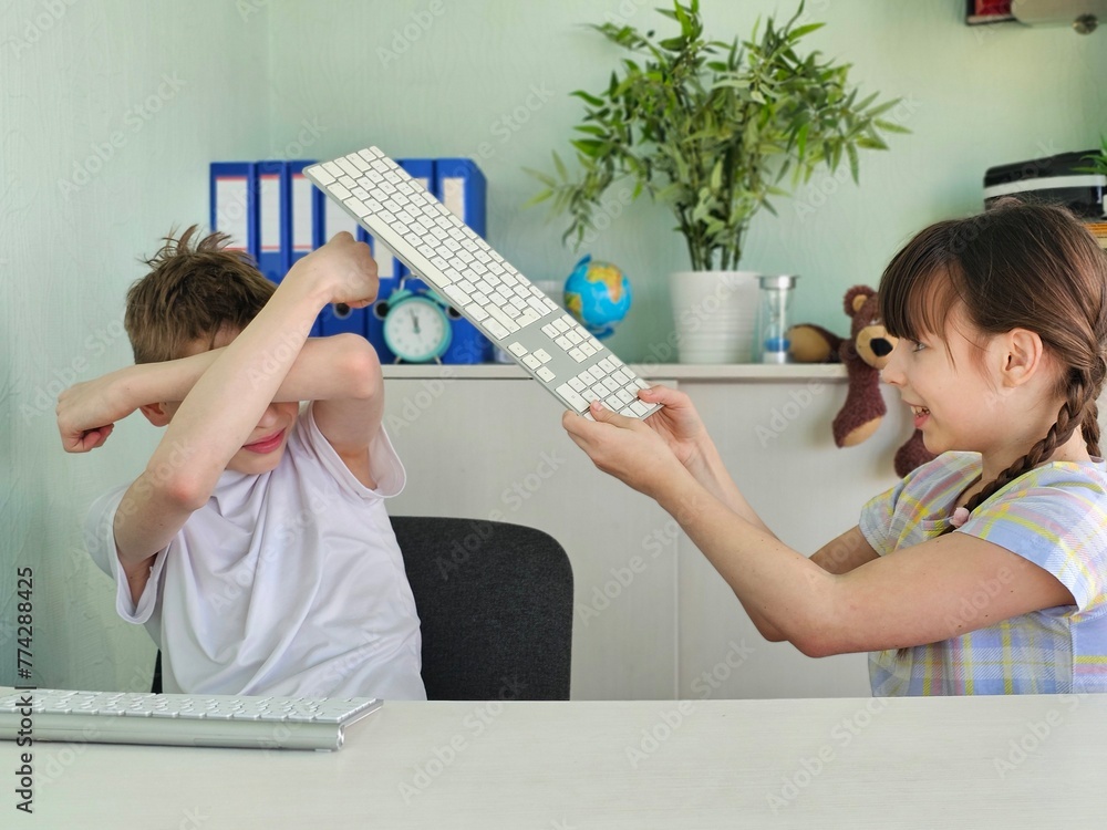 Girl child teenager furiously swings keyboard, hitting friend of ...