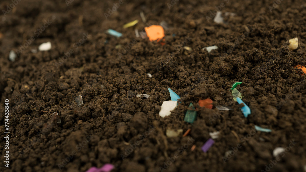 Microplastics inside the soil. Concept of plastic pollution ...
