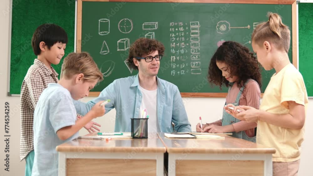 Smart teacher explain idea while diverse children drawing mind map ...