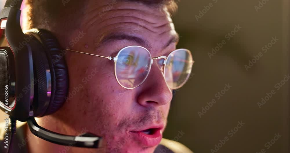 Gaming, headset and man in a house with glasses, live streaming or ...