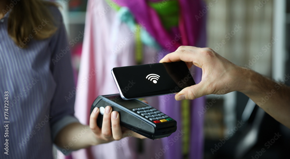 Female hand in dress market hold modern POS terminal closeup background ...