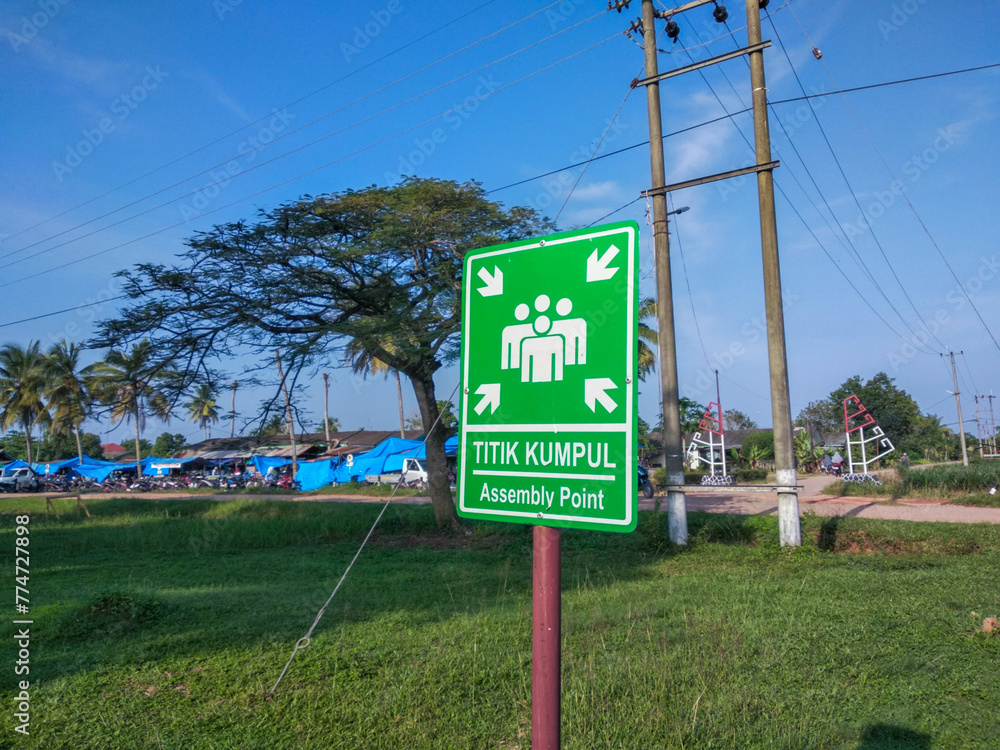 signboard of the assembly point or titik kumpul in Indonesian language ...