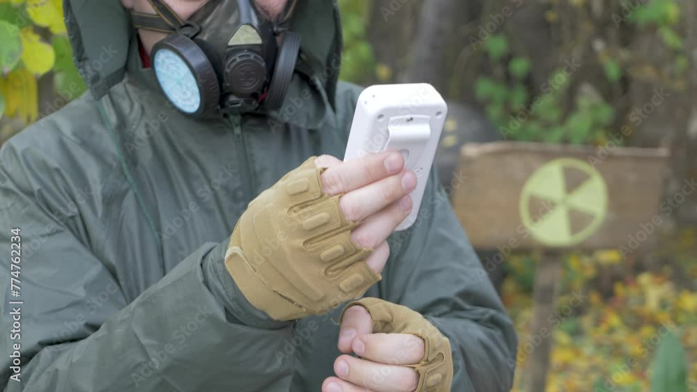 Unrecognizable radiation supervisor use Geiger counter. international ...