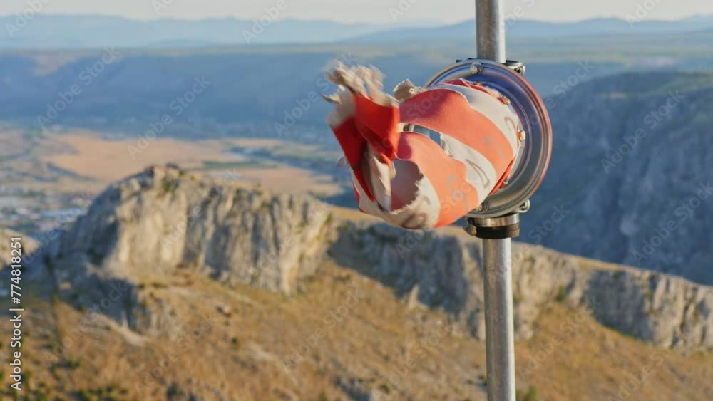 Close-up of a Torn Windsock Fluttering in a Strong Wind Showing Wind ...