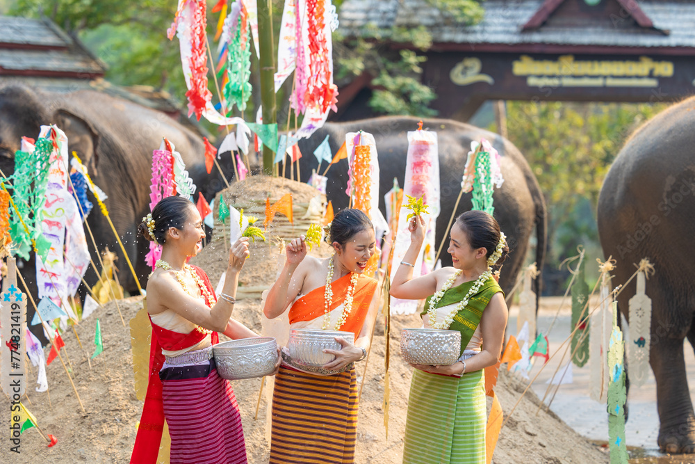Songkran festival. Northern Thai people in Traditional clothes dressing ...