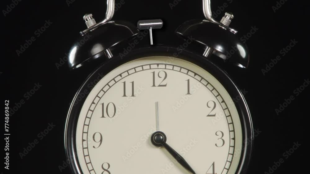 Vidéo Stock Alarm Clock Time. The hands of a classic alarm clock ...