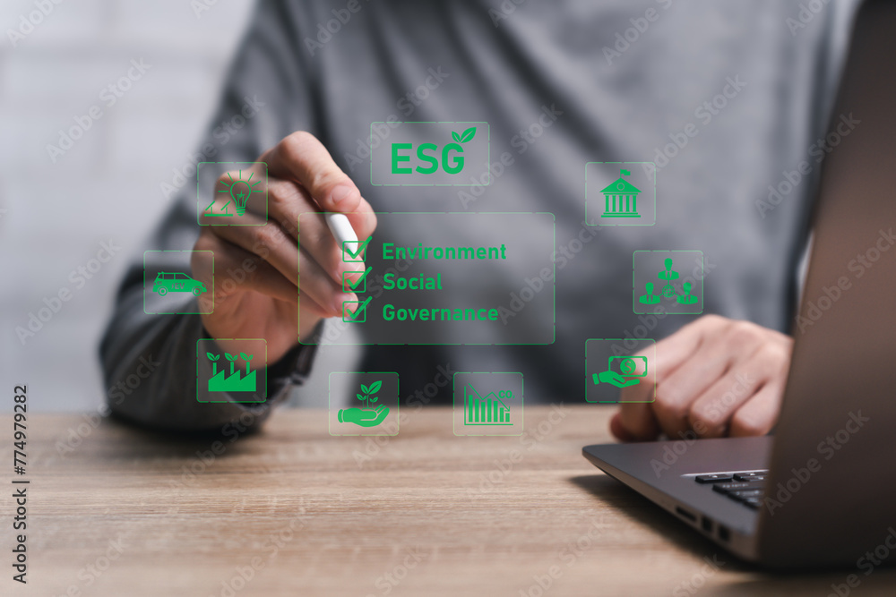 ESG environmental social governance business strategy investing concept, Women show mark on ESG ...