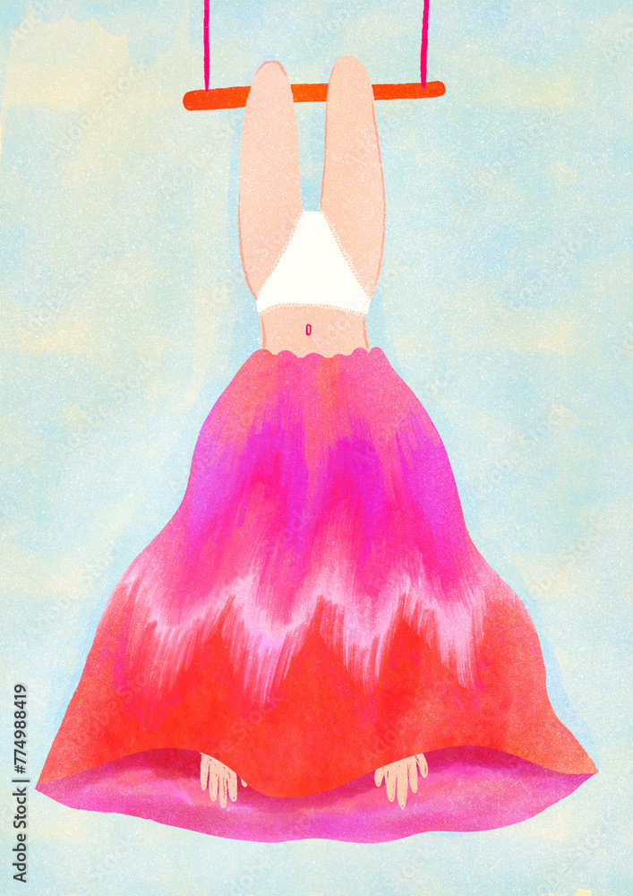 Young girl or woman hanging upside down on an acrobats swing with a ...