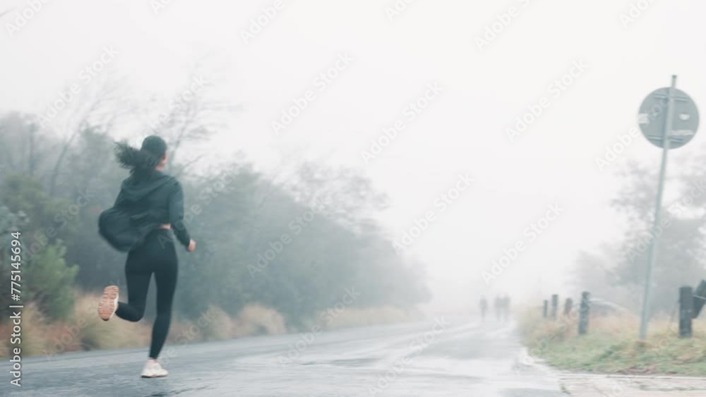 Woman, running and mountain for workout exercise in raining weather for ...