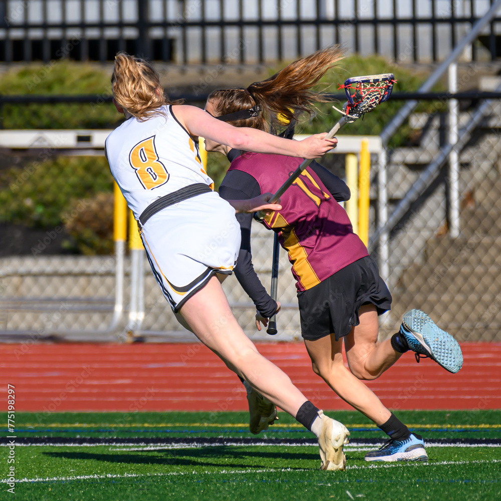 An offensive player with the ball is being chased by the defense. Girls ...