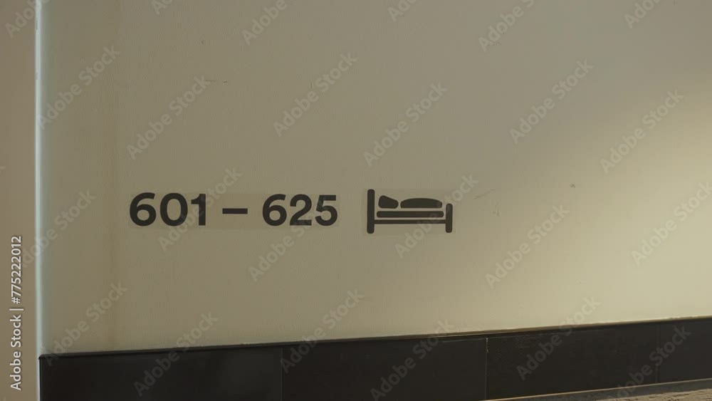 Indication of hotel room numbers on 6th floor in high-rise hotel on ...