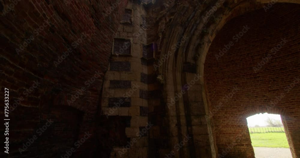 Tilting mid shot inside of St Benet’s abbey 16th century gatehouse with ...