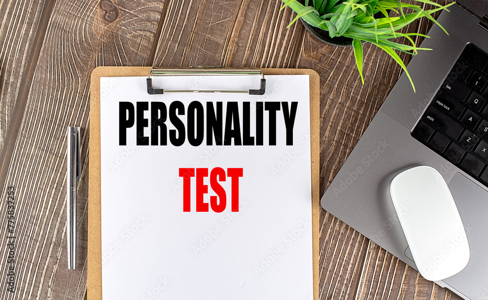 PERSONALITY TEST text on clipboard paper with laptop, mouse and pen ...