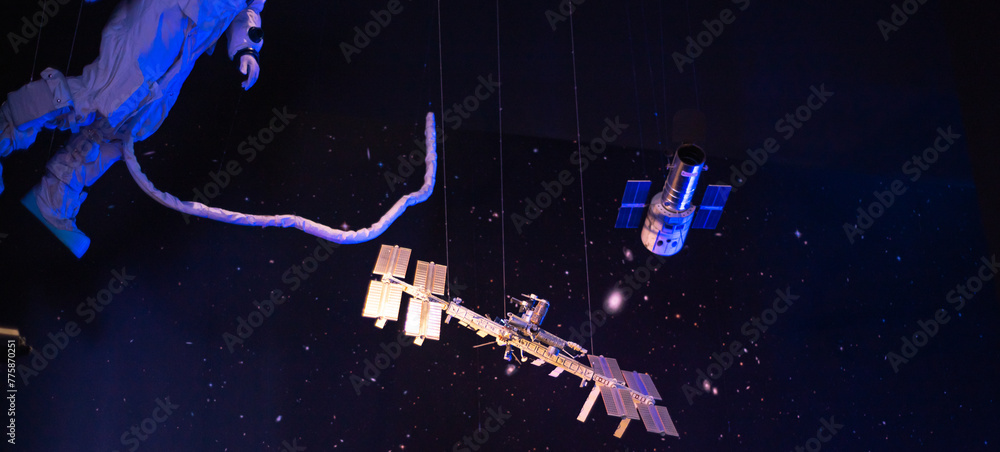 Panorama astronaut with safety umbilical cord tethers spacewalk walking ...