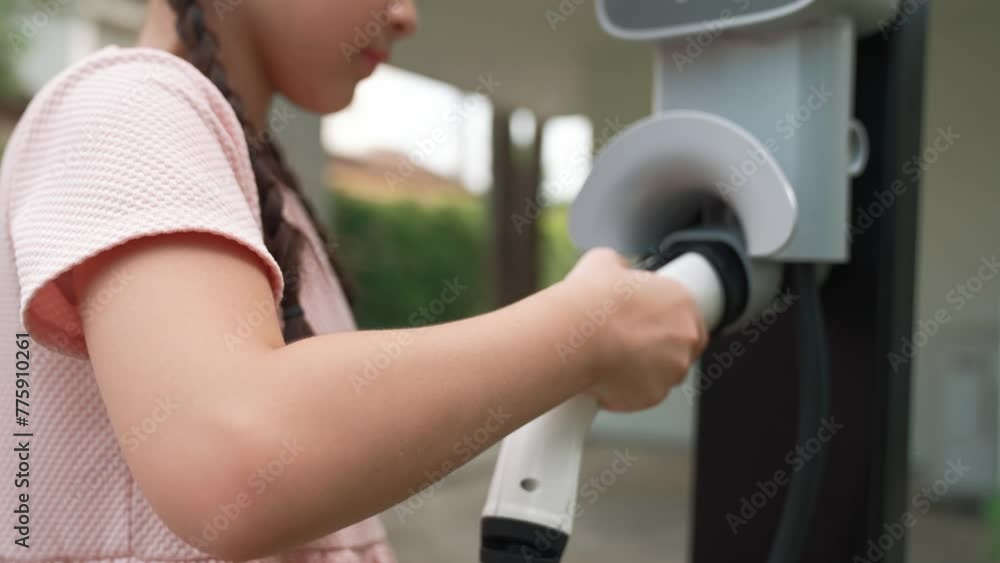 Happy little young girl learn about eco-friendly and energy ...