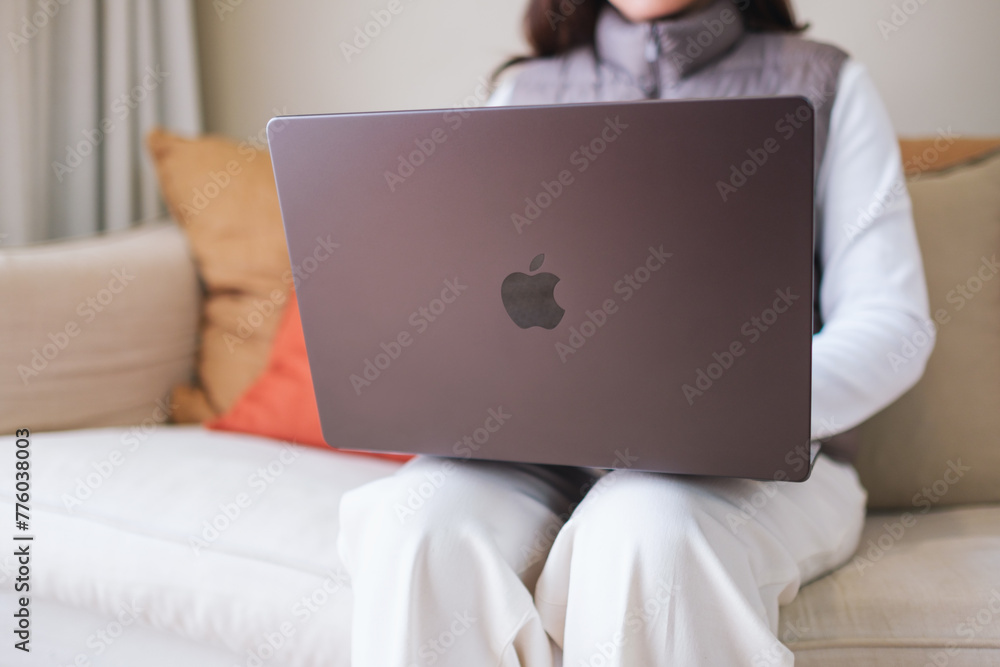 Mar 30th 2024 : A woman using and working on Apple MacBook Pro laptop ...