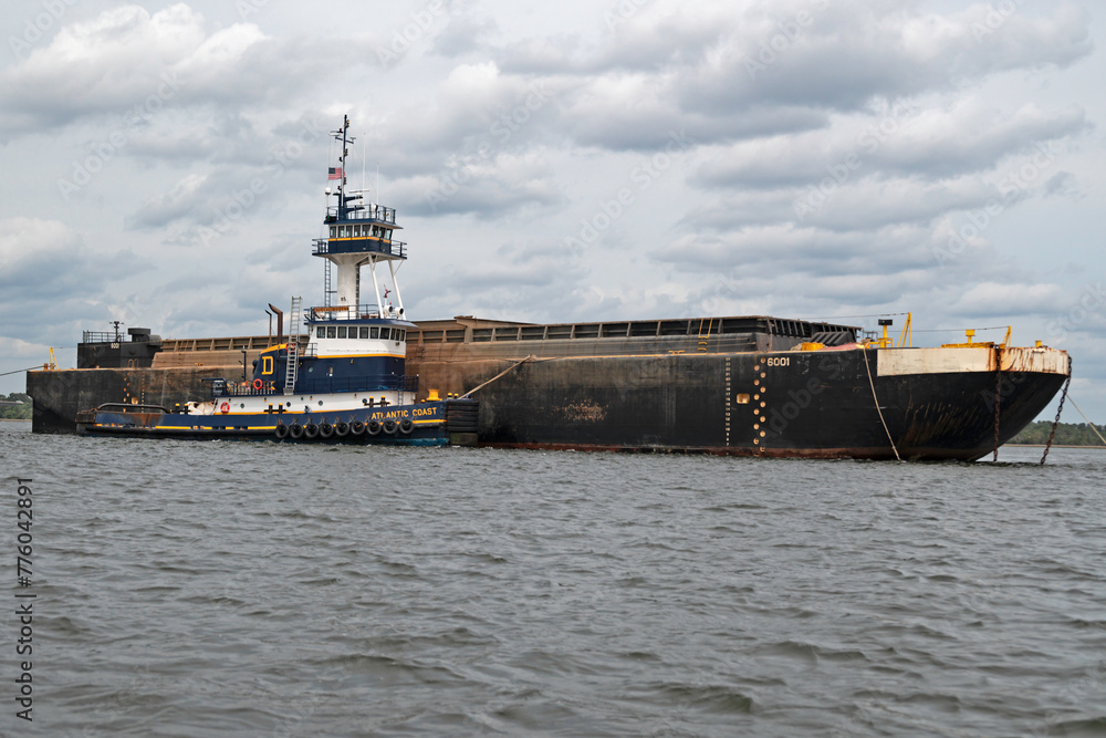 Tugboat Atlantic Coast alongside a barge on the Wando River in ...