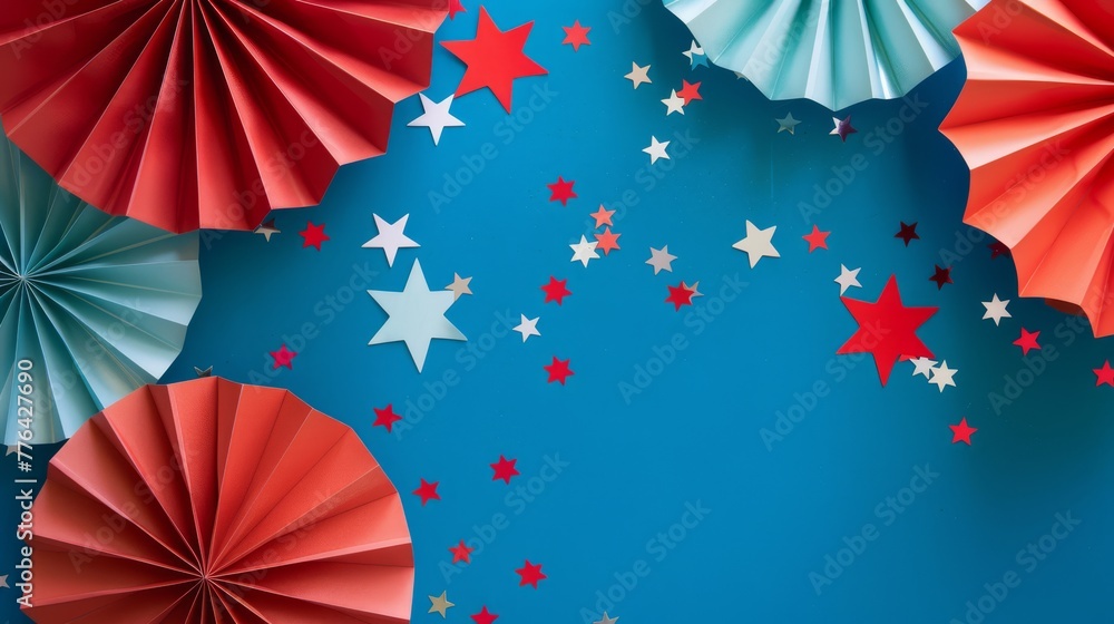 Festive paper rosettes and stars in red, white, and blue, arranged as a ...