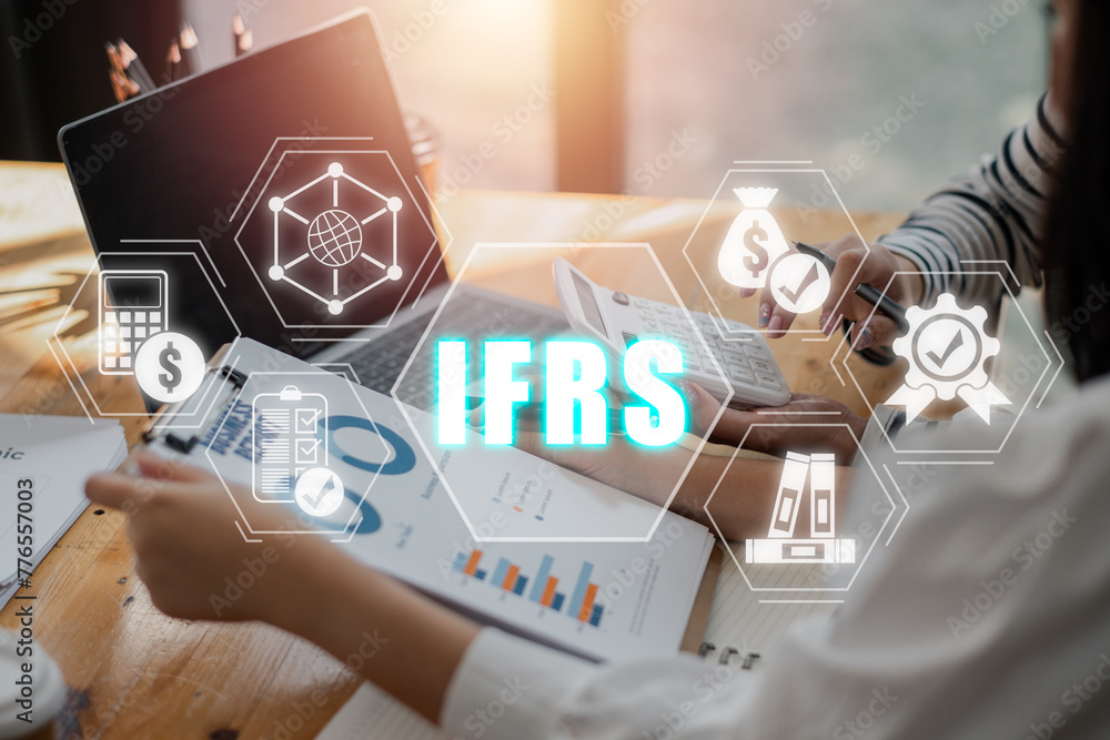 IFRS, International Financial Reporting Standards concept, Business team analyzing income charts ...