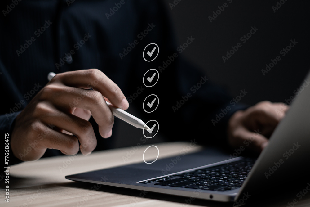 Foto de Checklist concept. Businessman tick correct mark to corporate ...