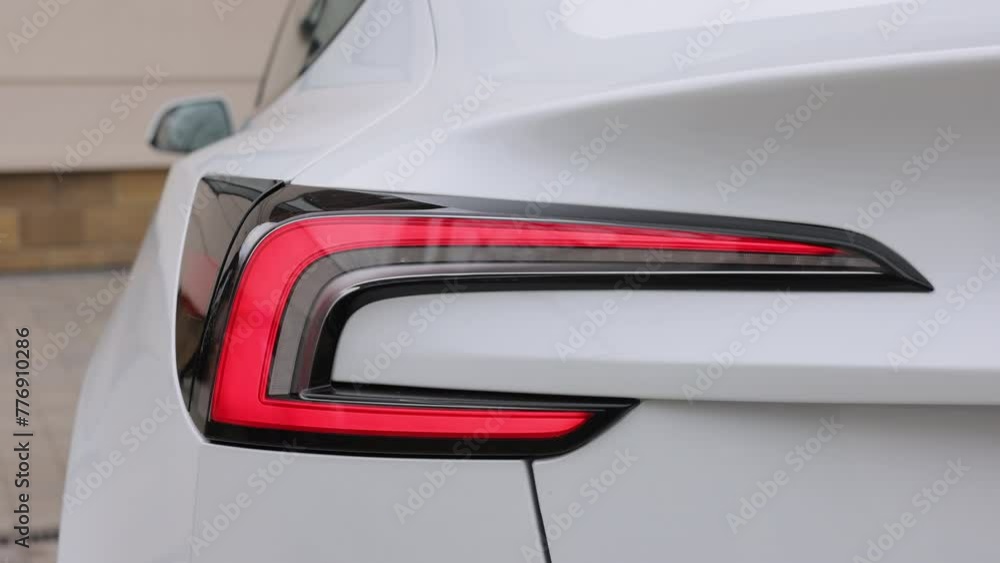 Flashing turn signal indicating the correct direction. Tail light ...