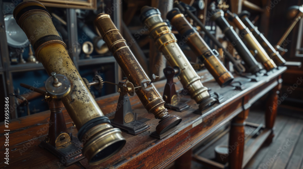 A classic collection of vintage brass telescopes neatly aligned on a ...