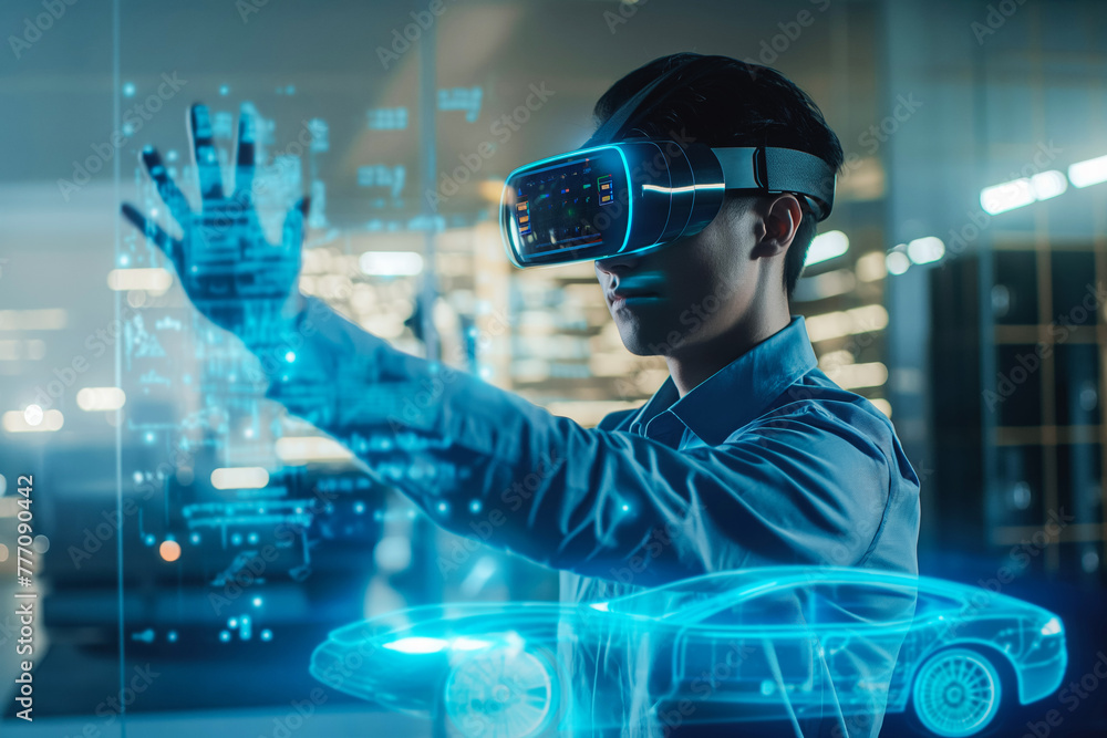 Young Adult Male Engineer Using Futuristic Augmented Reality Software Interface for Managing ...