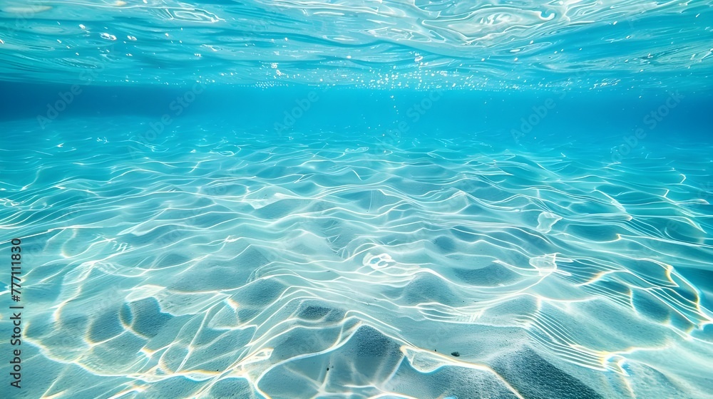 Photo of clear blue water, with light ripples and small waves on the ...