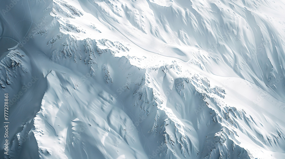 Bird's eye perspective of a snowy mountain range, with ski tracks, wide ...