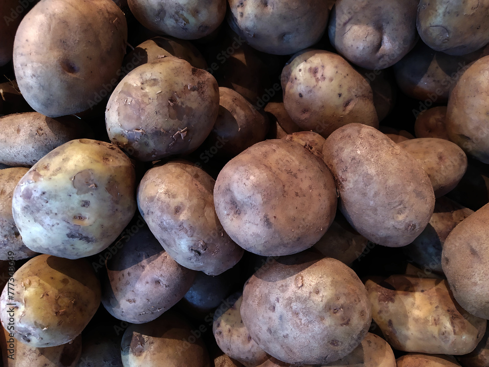 Selective focus of fresh raw organic potatoes on market stall, The ...