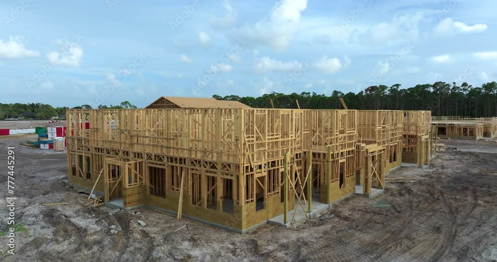 Wooden construction frame of new condo building under development ...