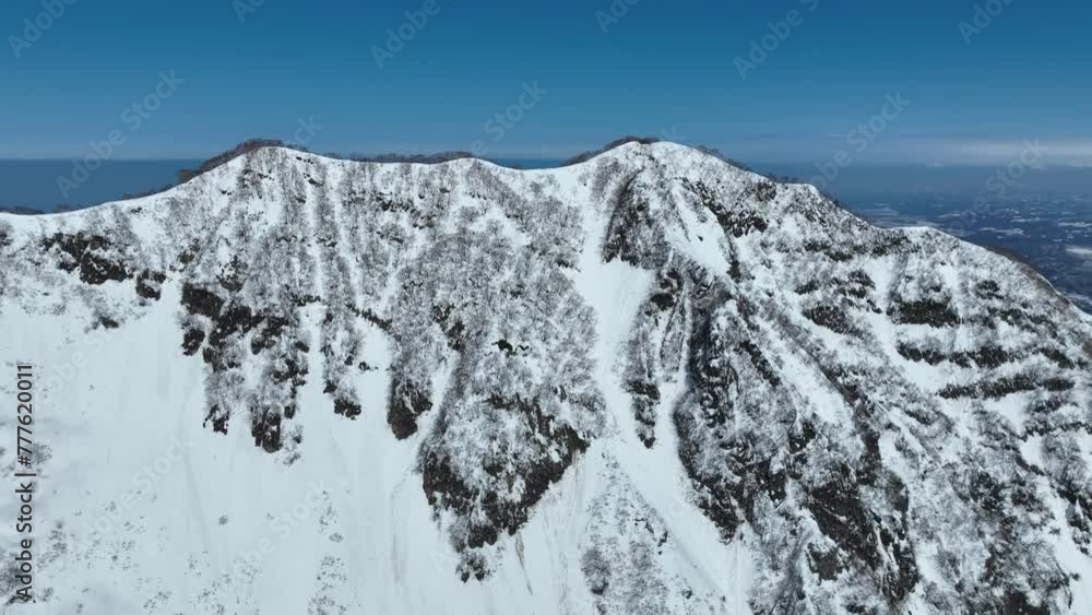 Aerial shot push in over top of Myoko Mountain Summit, Japans coast ...