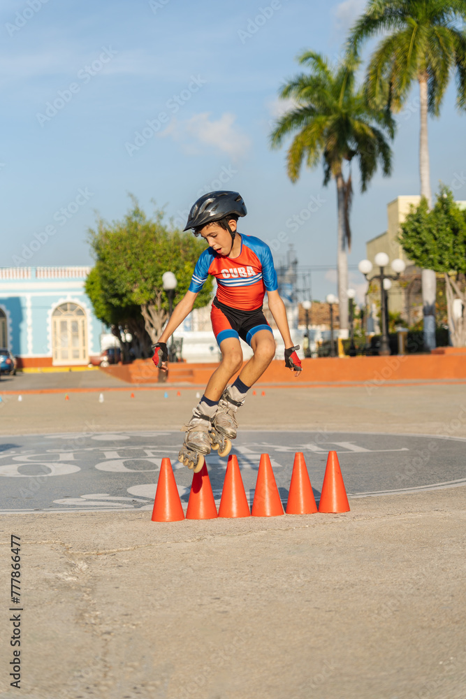 Child Jumping Over Obstacles In A Roller Skating Class Outdoors. Stock ...
